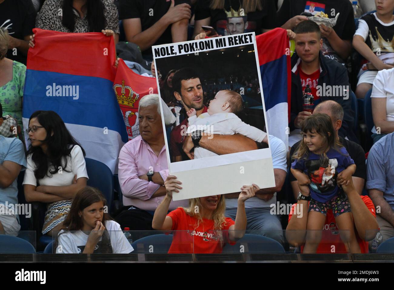 Fans holding Serbian flags and a placard of Novak Djokovic of Serbia in ...