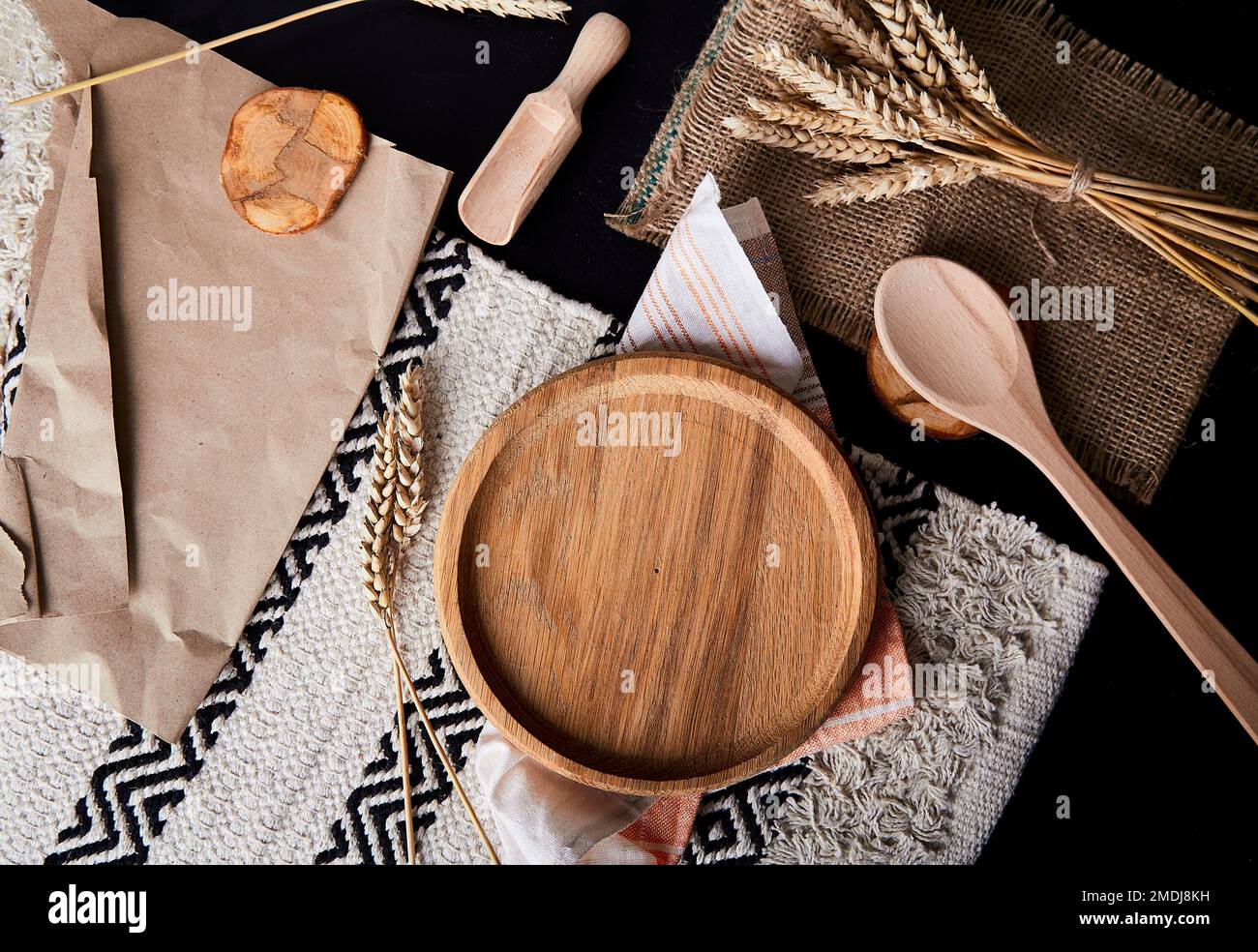 Wooden plate, tray, layout, kitchen cutlery flat lay with wheat grains ...