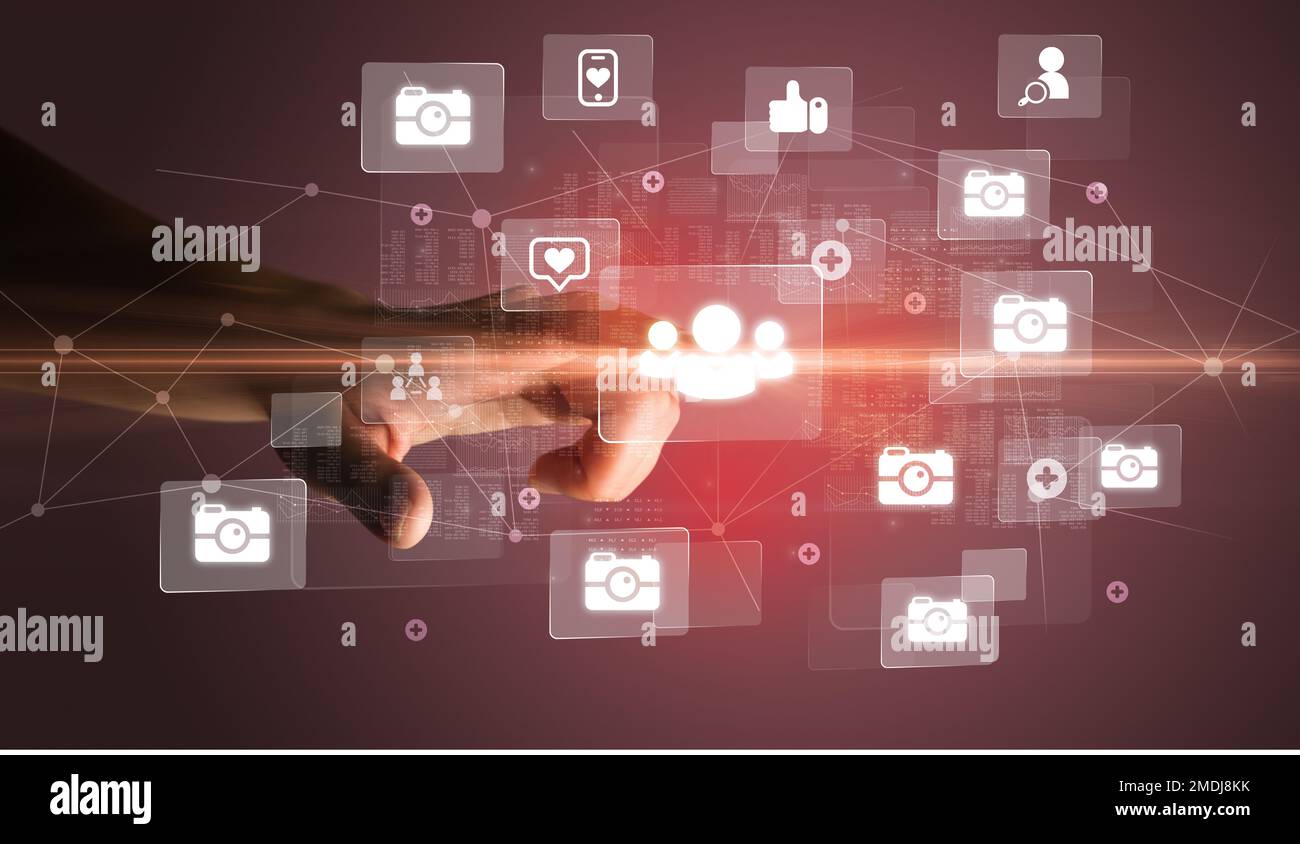 Hand pressing social media multimedia application screen with media ...