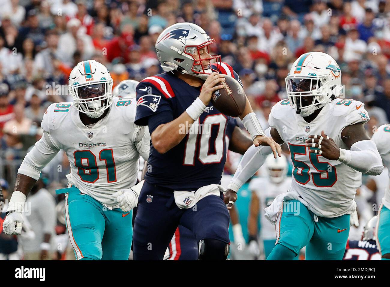 New England Patriots quarterback Mac Jones scrambles against the Miami ...