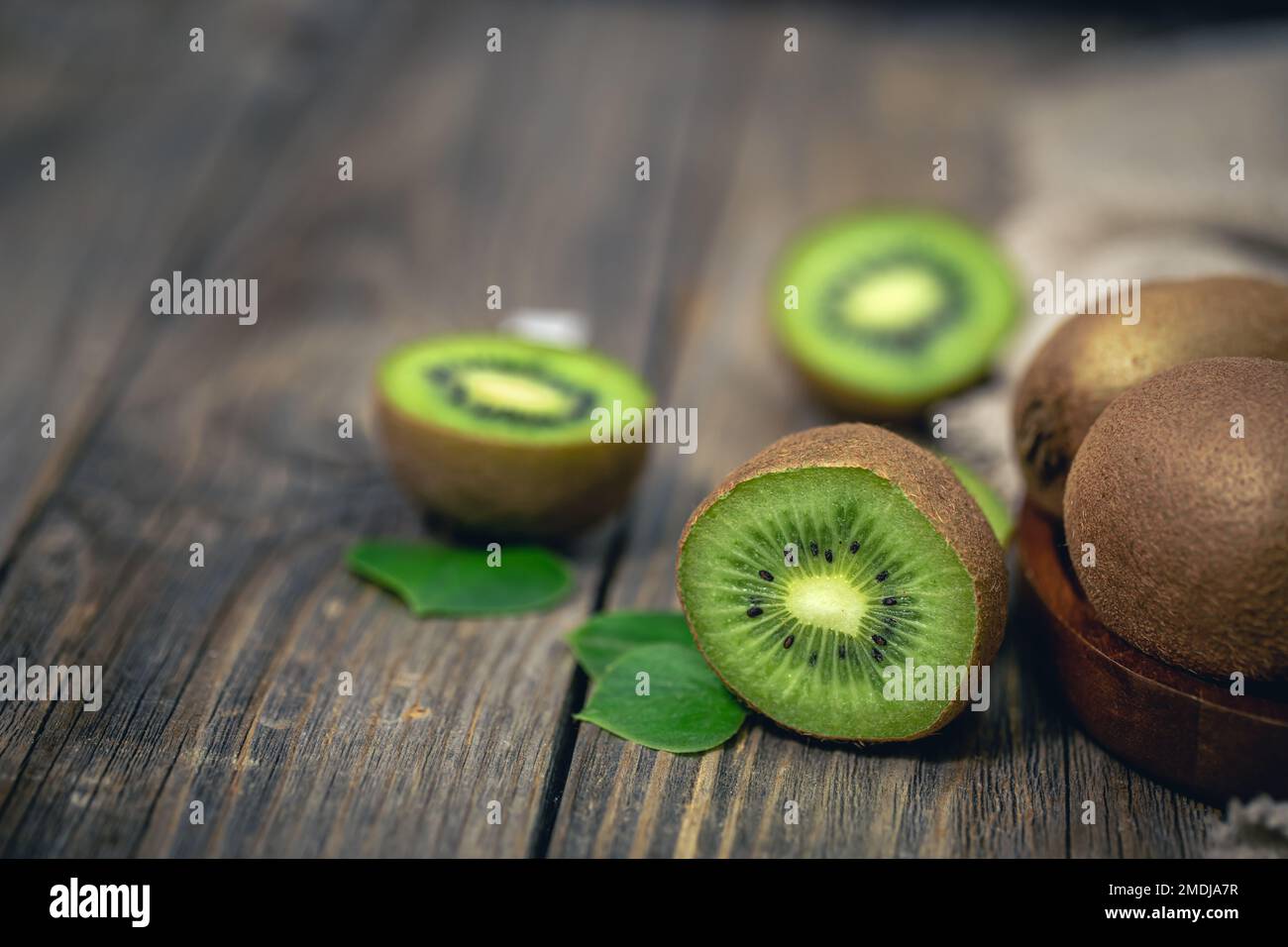 Close -up, cut fruit kiwi on a wooden background, rustic style Stock ...