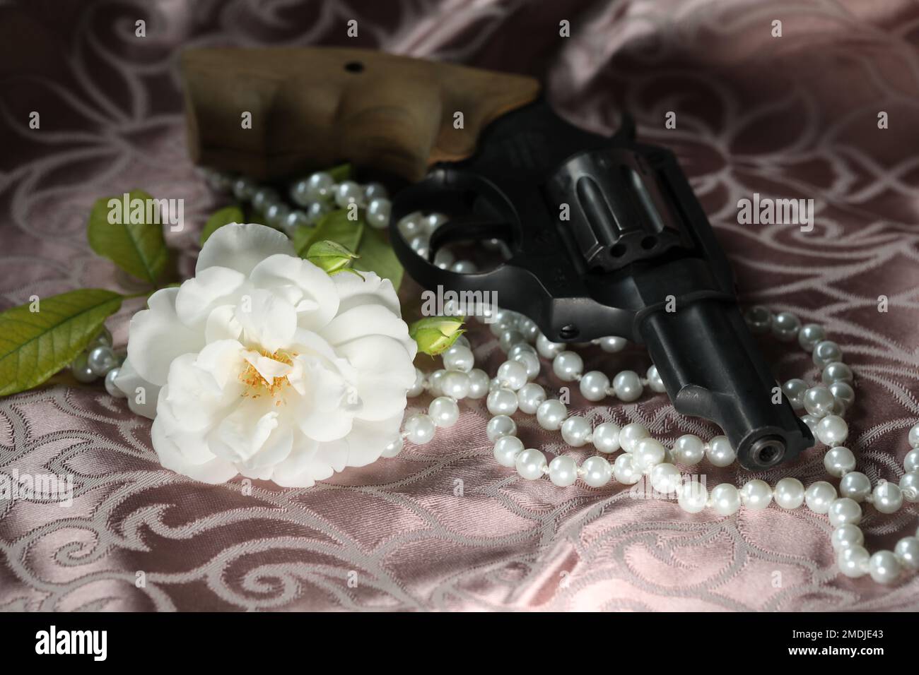 white beautiful rose with pearls and gun. romantic. copy space Stock ...