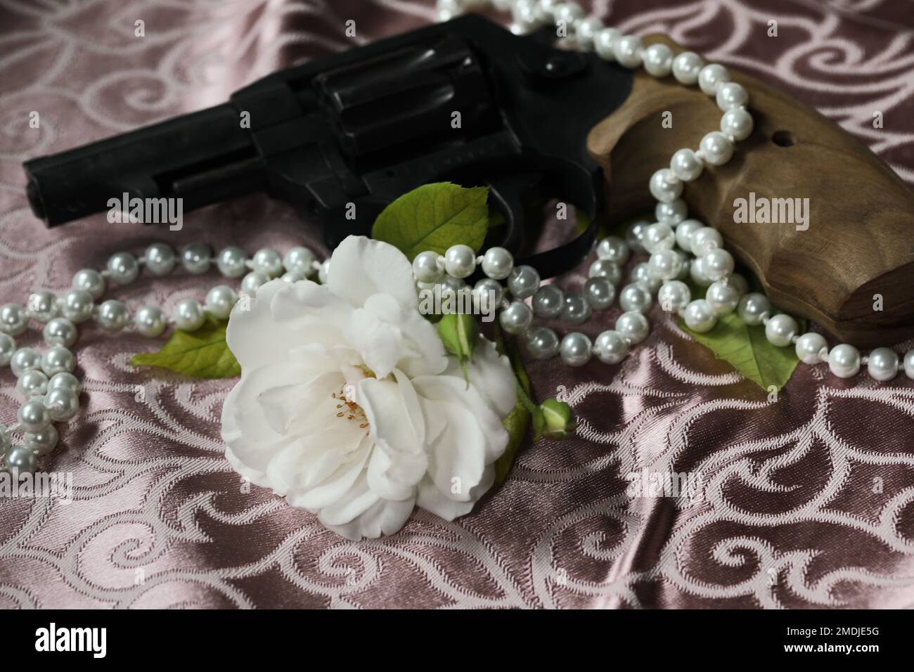 white beautiful rose with pearls and gun. romantic. copy space Stock ...