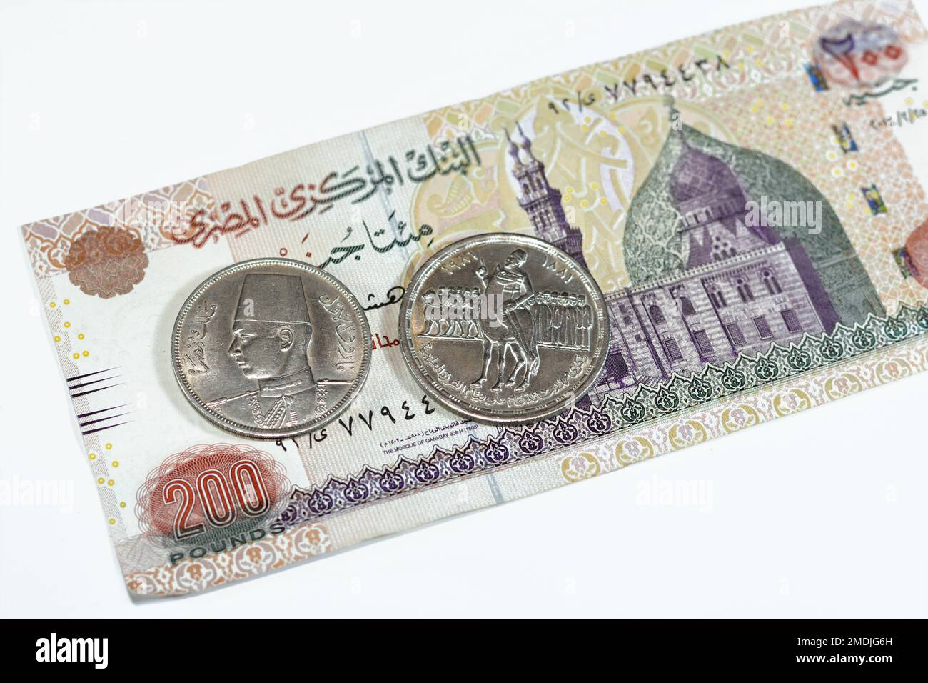 Background of old Egyptian money banknotes and coins of two hundred ...