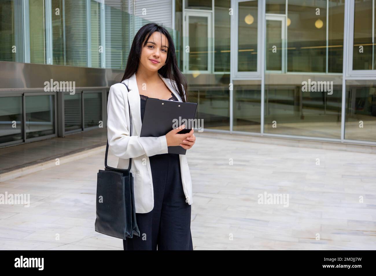 Close up portrait of a young executive businesswoman in urban outdoors ...
