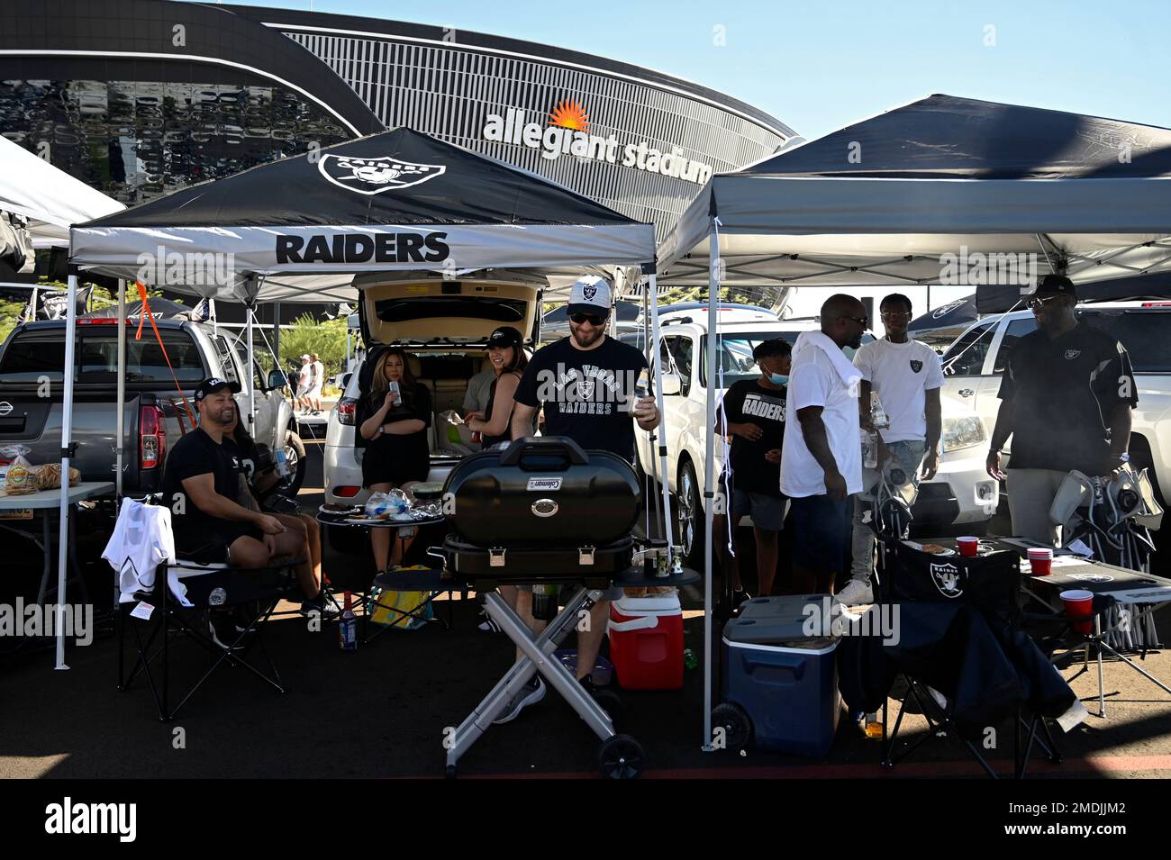 Fans tailgate before an NFL football game between the Las Vegas Raiders ...