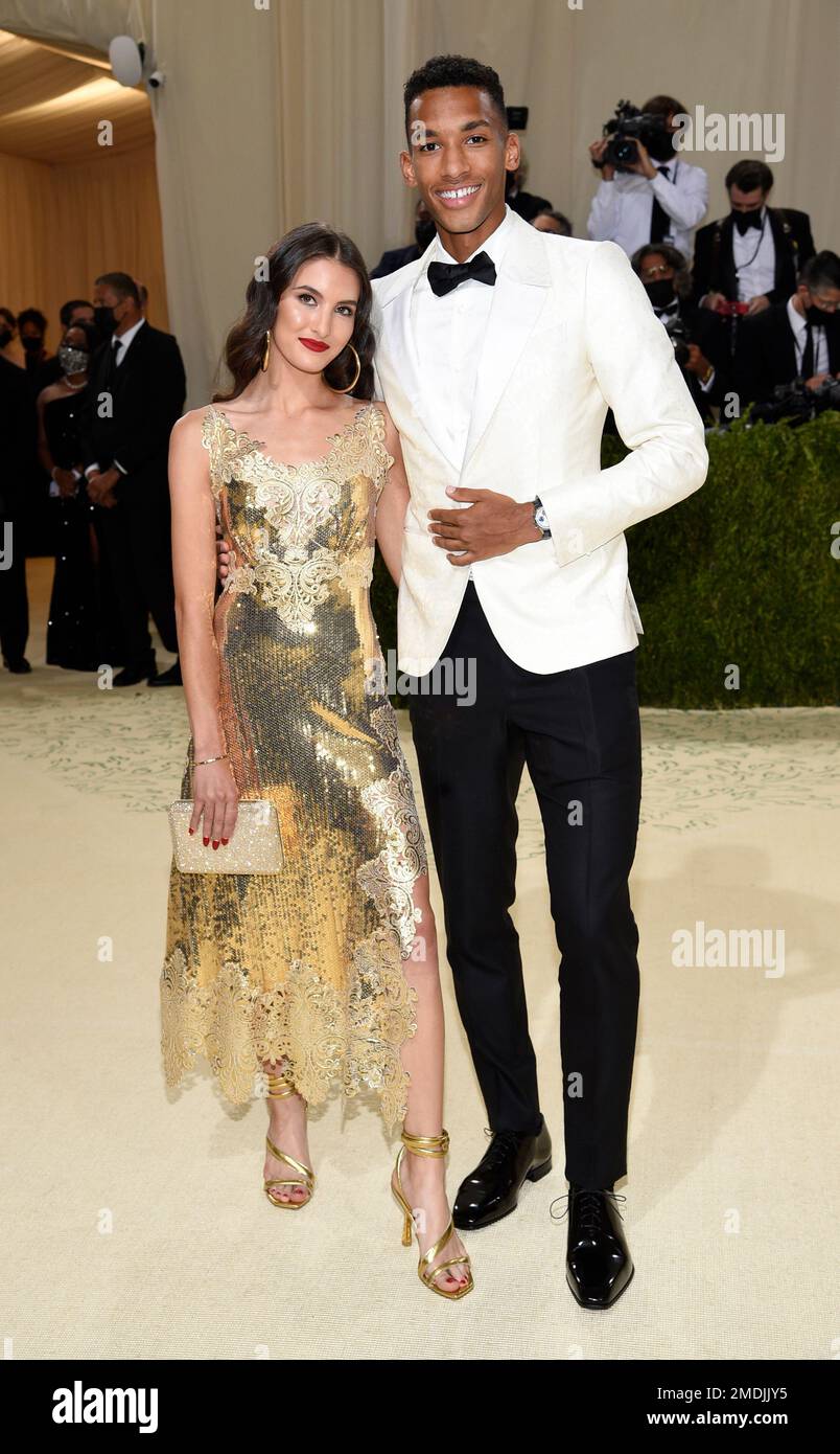 Nina Ghaibi, left, and Felix Auger Aliassime attend The Metropolitan ...