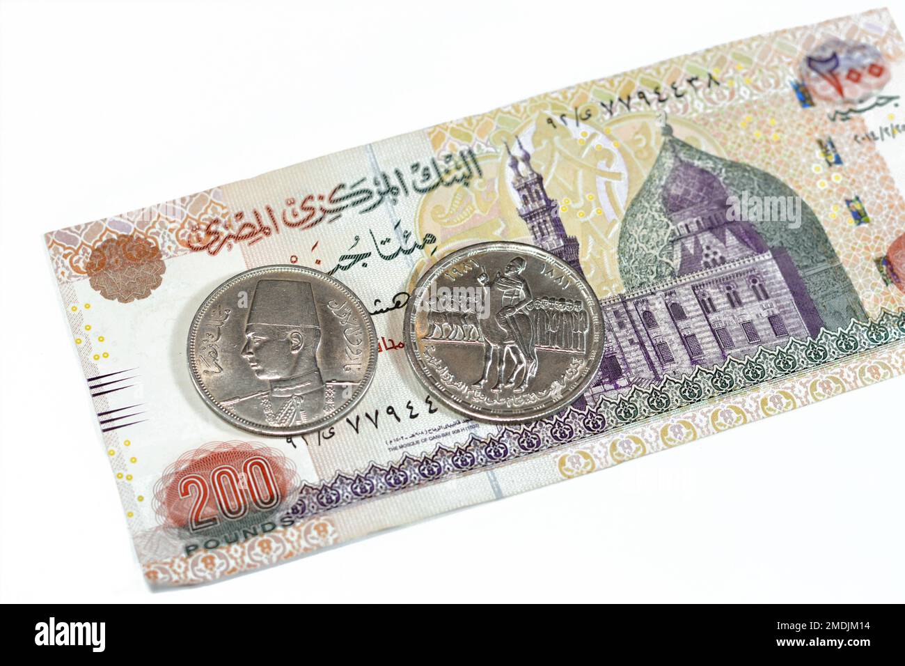 Background of old Egyptian money banknotes and coins of two hundred ...