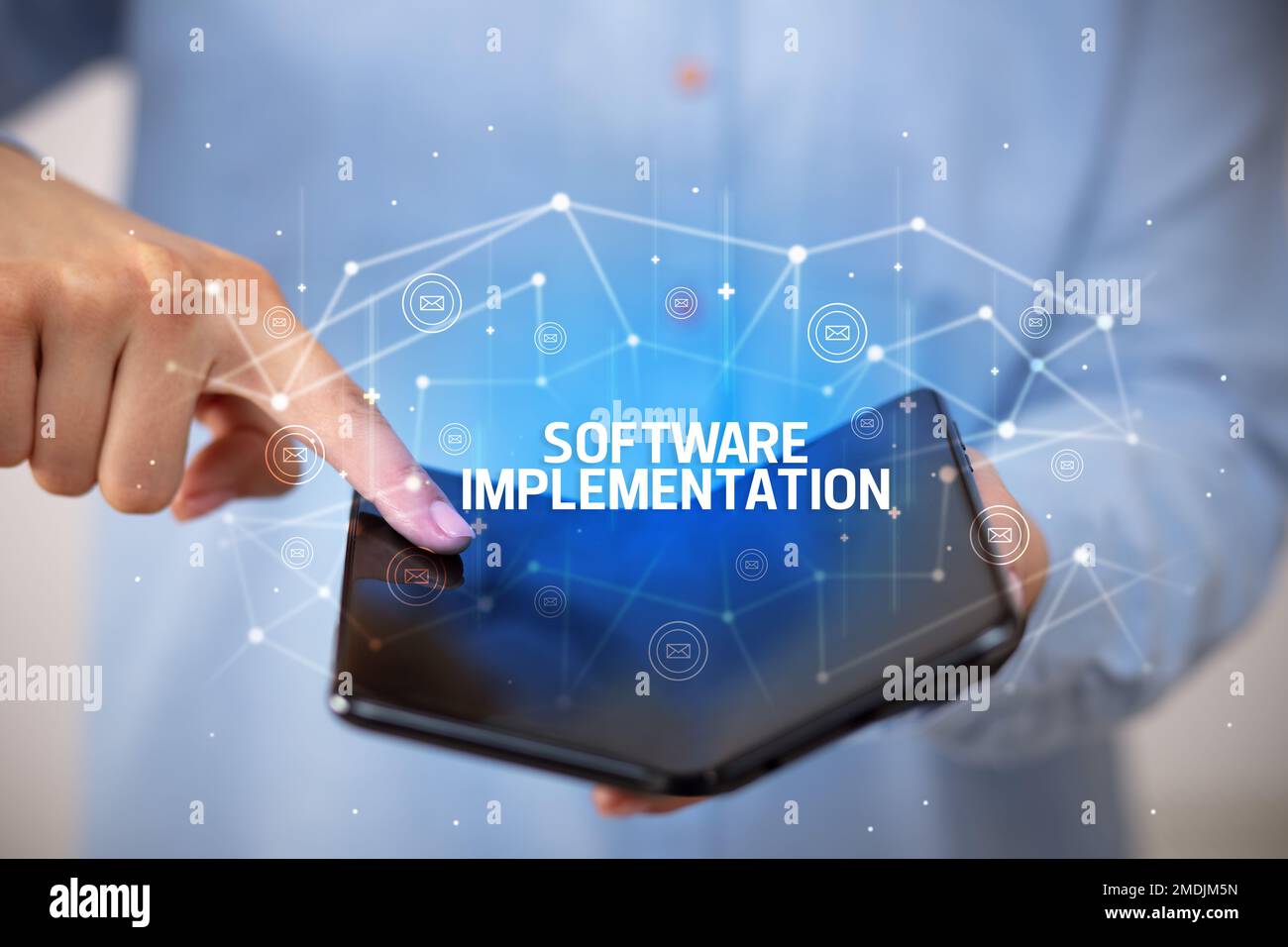 Businessman holding a foldable smartphone, new technology concept Stock ...