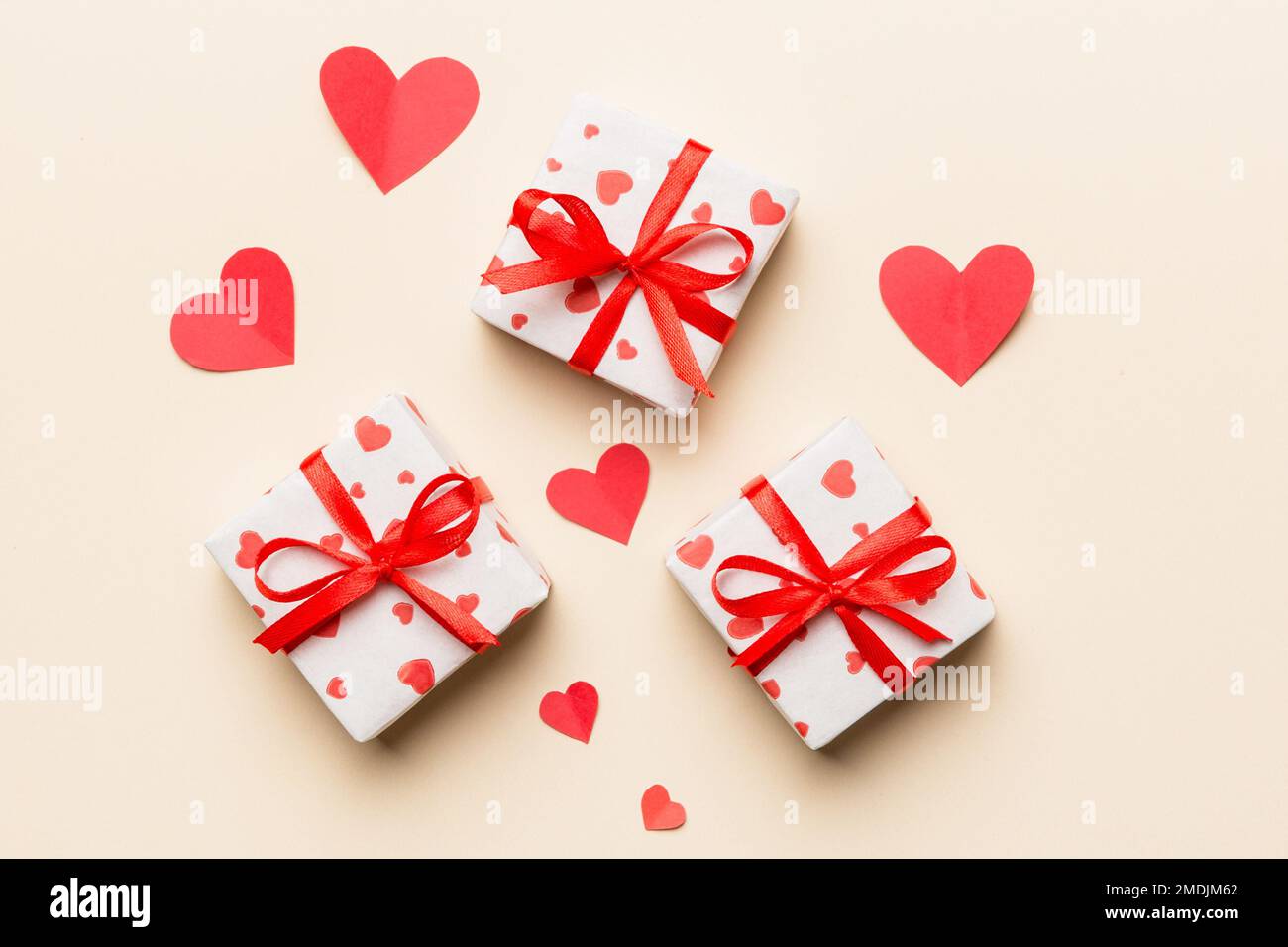Valentine day composition Background: red gift box with bow and heart ...