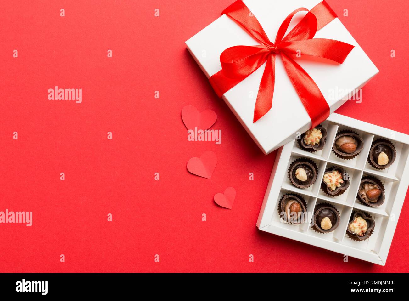 Delicious chocolate pralines in red box for Valentine's Day. Heart ...