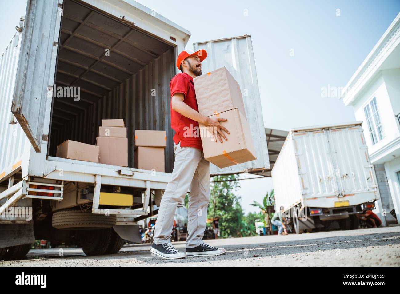 Courier lifting box delivery service hi-res stock photography and ...