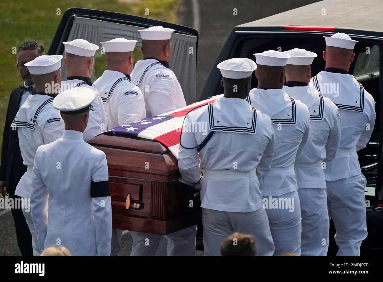 The body of Navy Corpsman Maxton Soviak is put into the hearse at ...