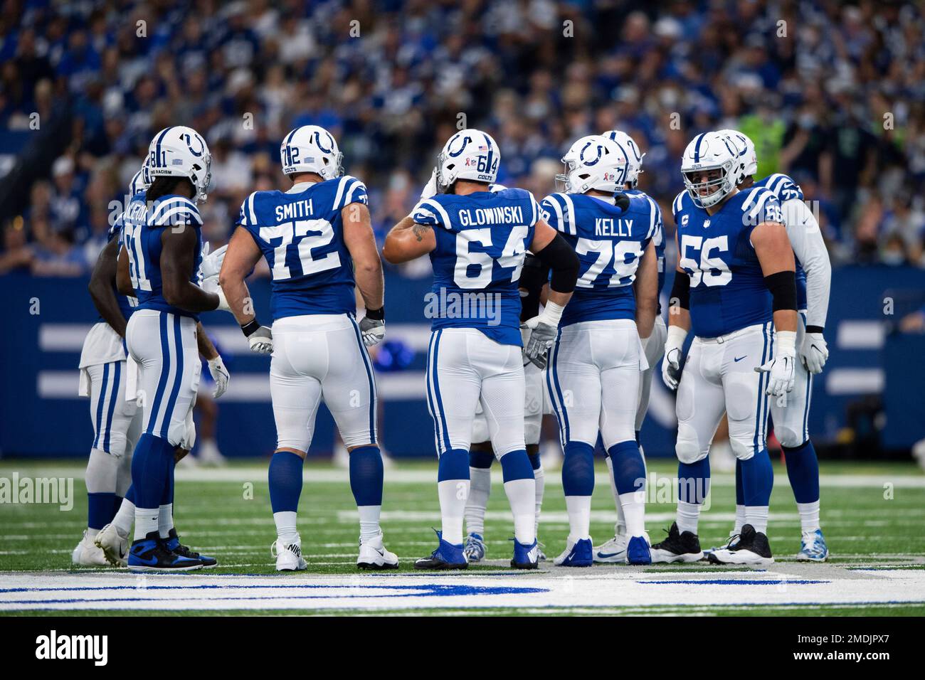 The Indianapolis Colts offense huddles on the field during an NFL ...