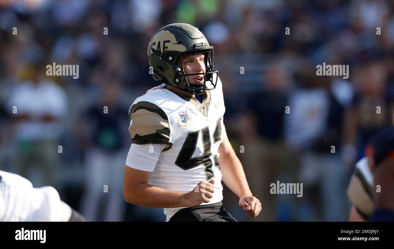 Air Force kicker Matthew Dapore kicks an extra point against Navy ...