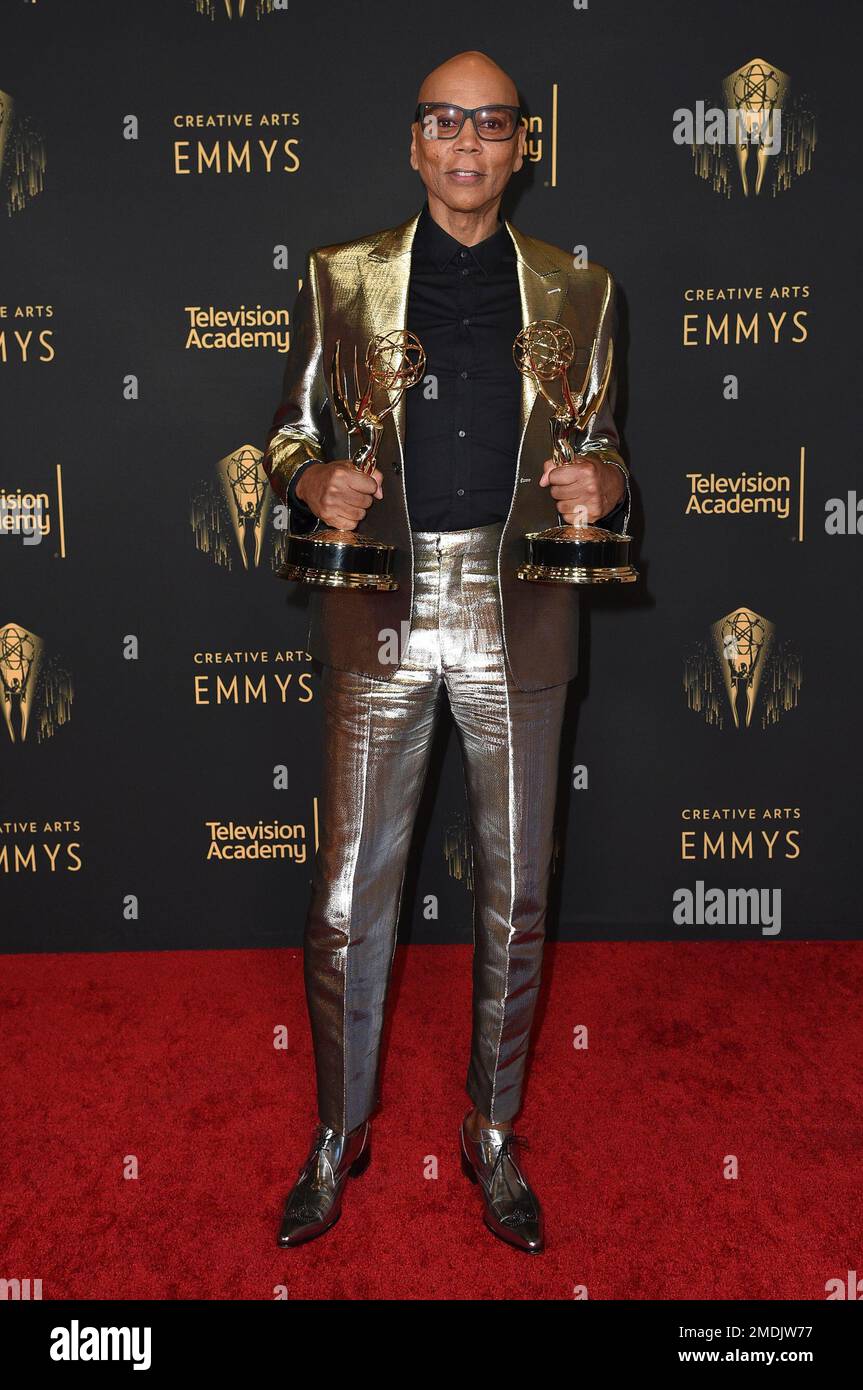 RuPaul poses with the award for outstanding host for a reality or ...