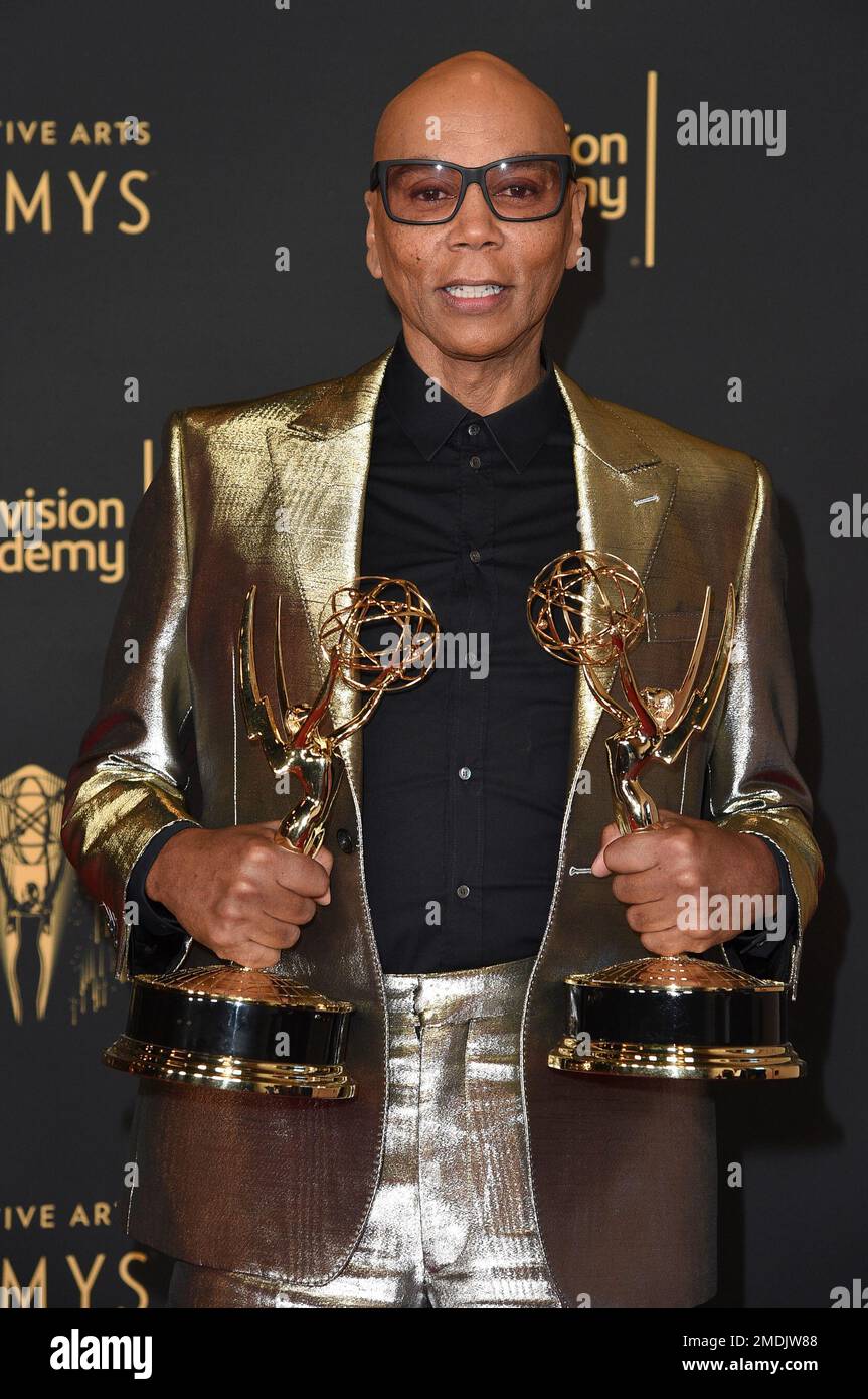 RuPaul poses with the award for outstanding host for a reality or ...