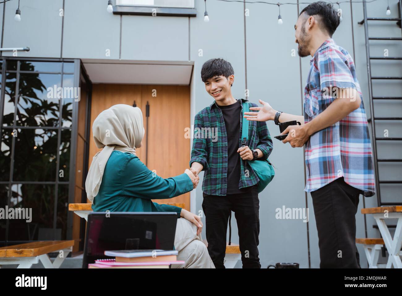 college students get to know each other by shaking hands Stock Photo ...