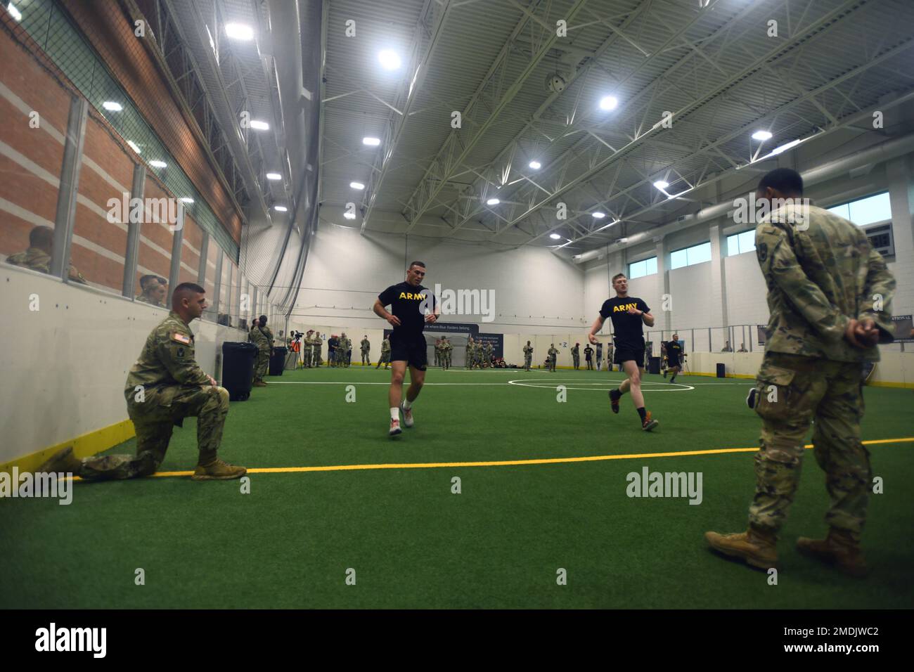 Army Sgt. Richard Carlson (left, in Army Physical Fitness Uniform), a ...