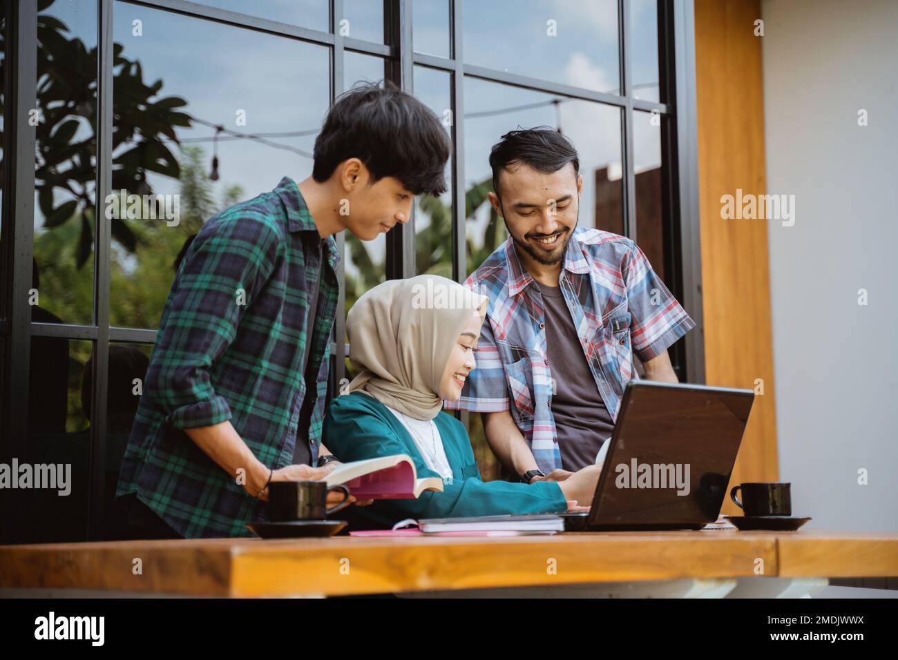 groups of students meet in the cafe for joint discussions Stock Photo ...