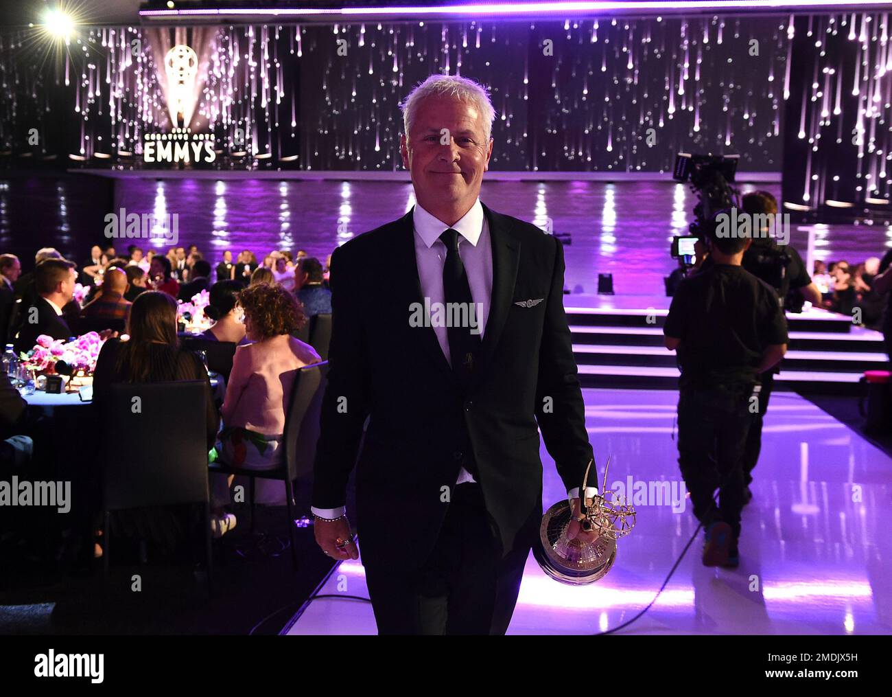 Blake Neely accepts the Emmy for outstanding main title theme music for ...