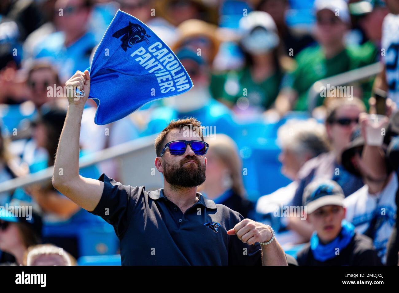 A Carolina Panthers fan cheers during the first half of an NFL football ...