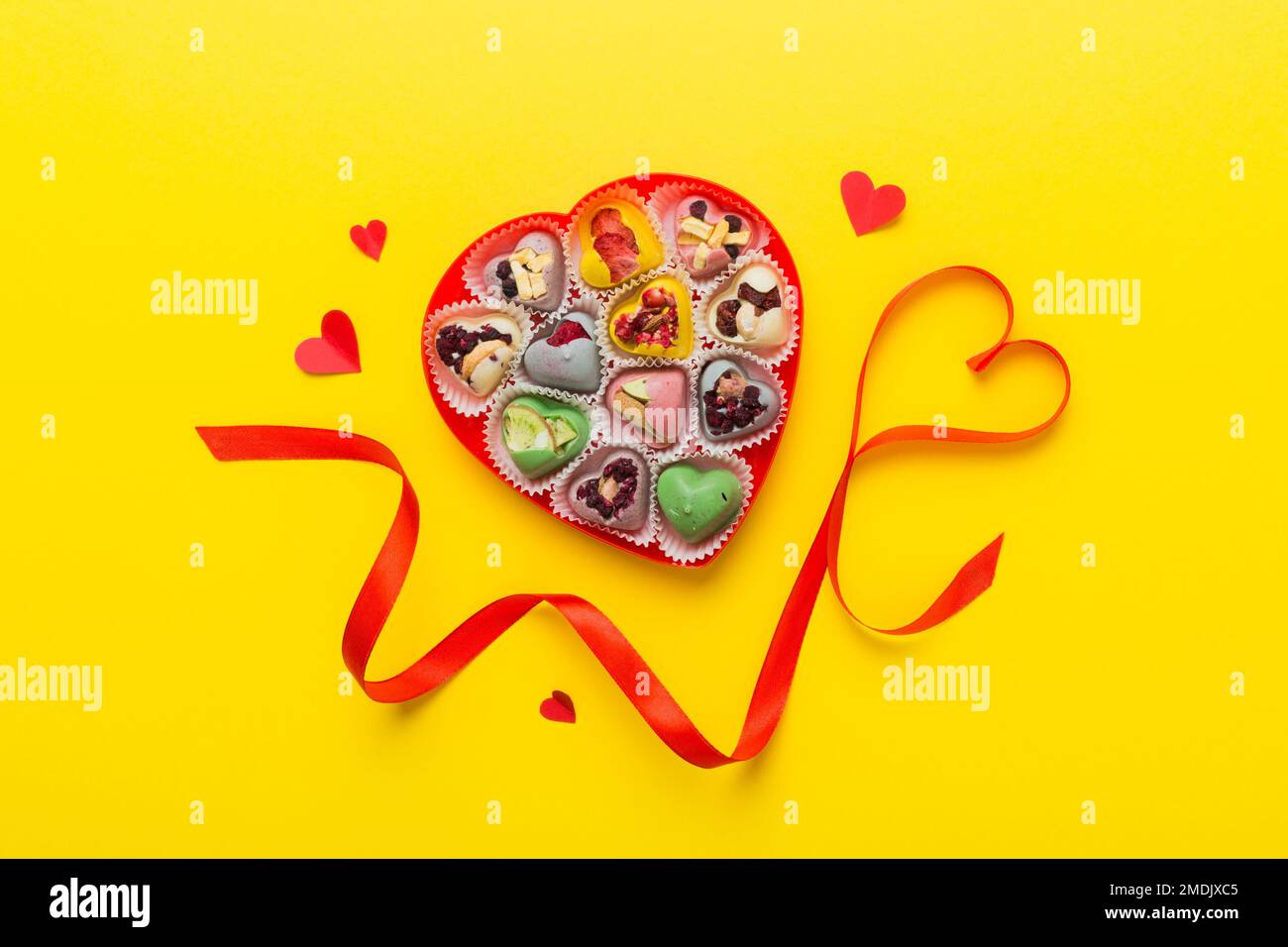 Valentine day composition: sweet candy, with gift boxes with bow and ...