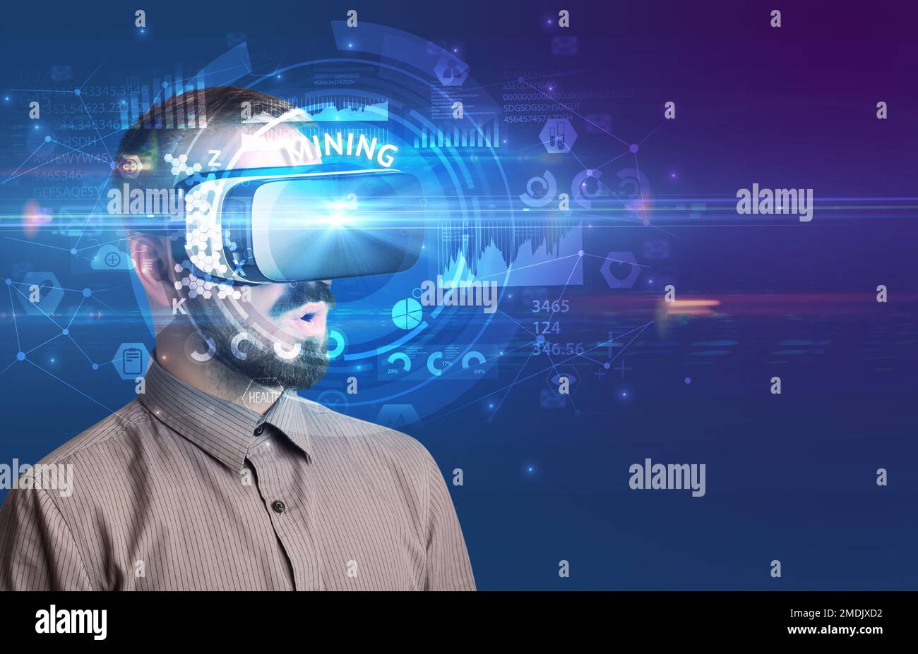 Businessman looking through VR glasses Stock Photo - Alamy