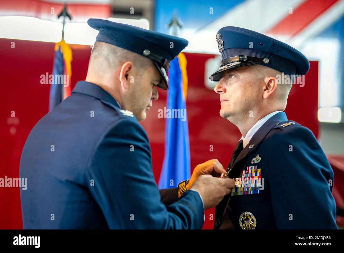 U.S. Air Force Col. Brian Filler, 501st Combat Support Wing commander, pins on the Legion of ...