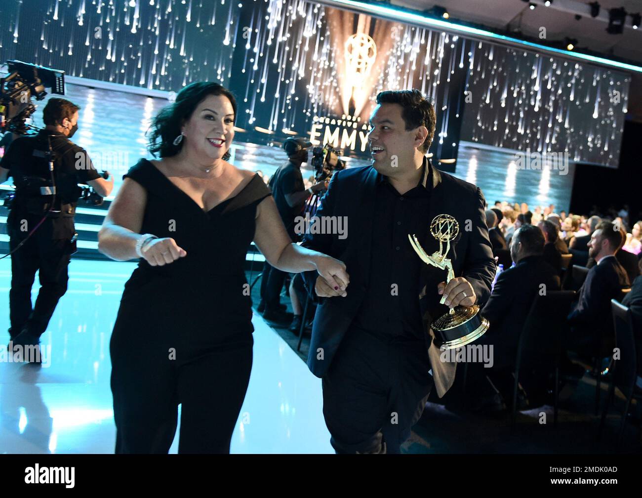 Kristen Anderson-Lopez, left, and Robert Lopez accept the Emmy for ...