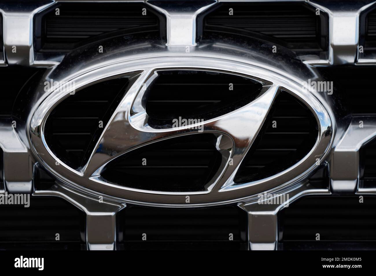 The company logo shiones of the grille of an unsold 2022 Santa Fe ...