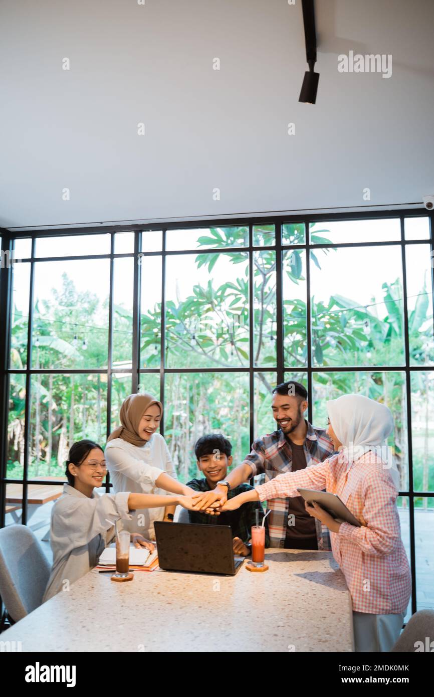 group of asian students with hand gesture symbol of unity Stock Photo ...