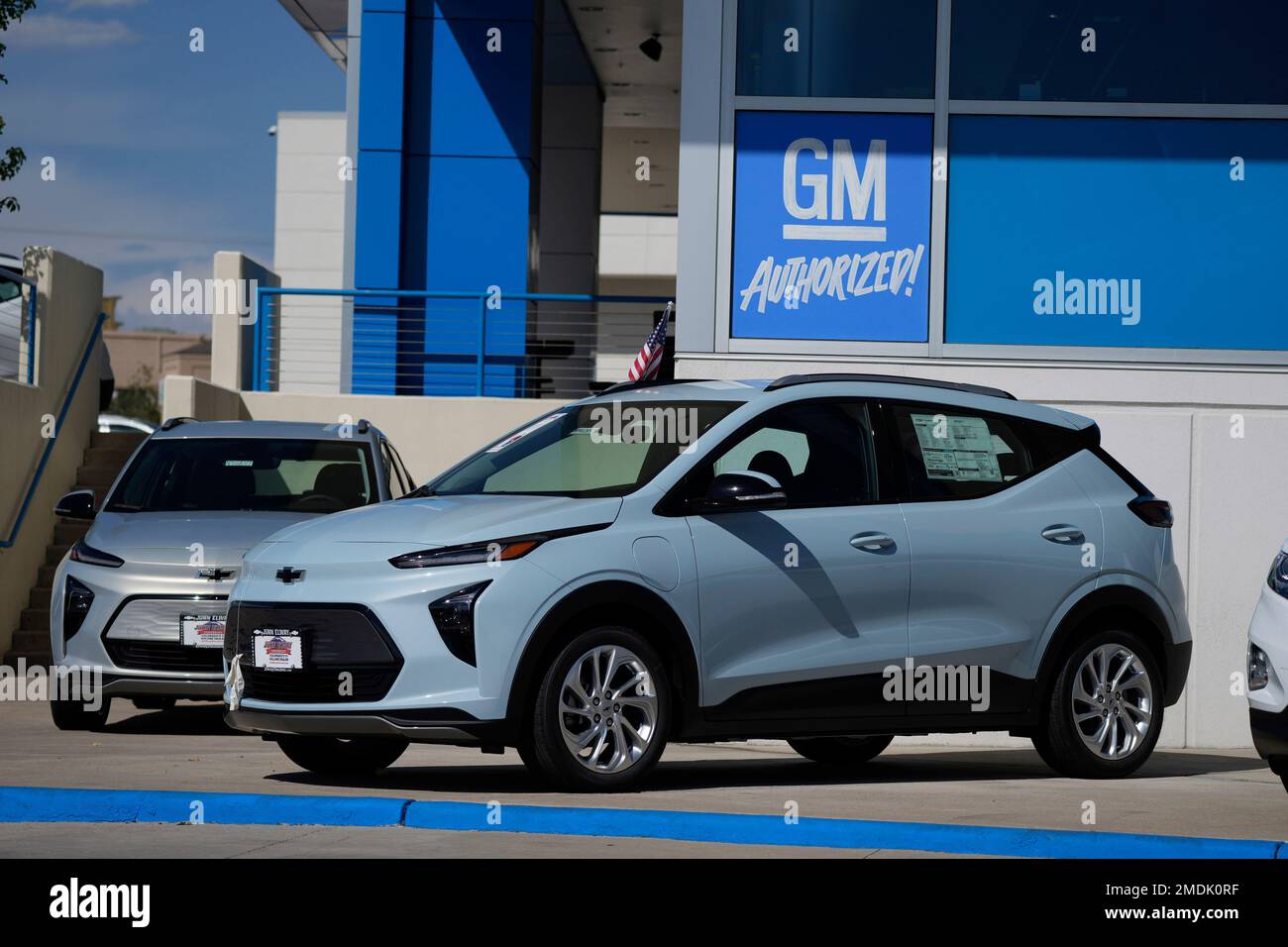 Unsold 2022 Bolt electric vehicles sit in an empty storage lot at a ...
