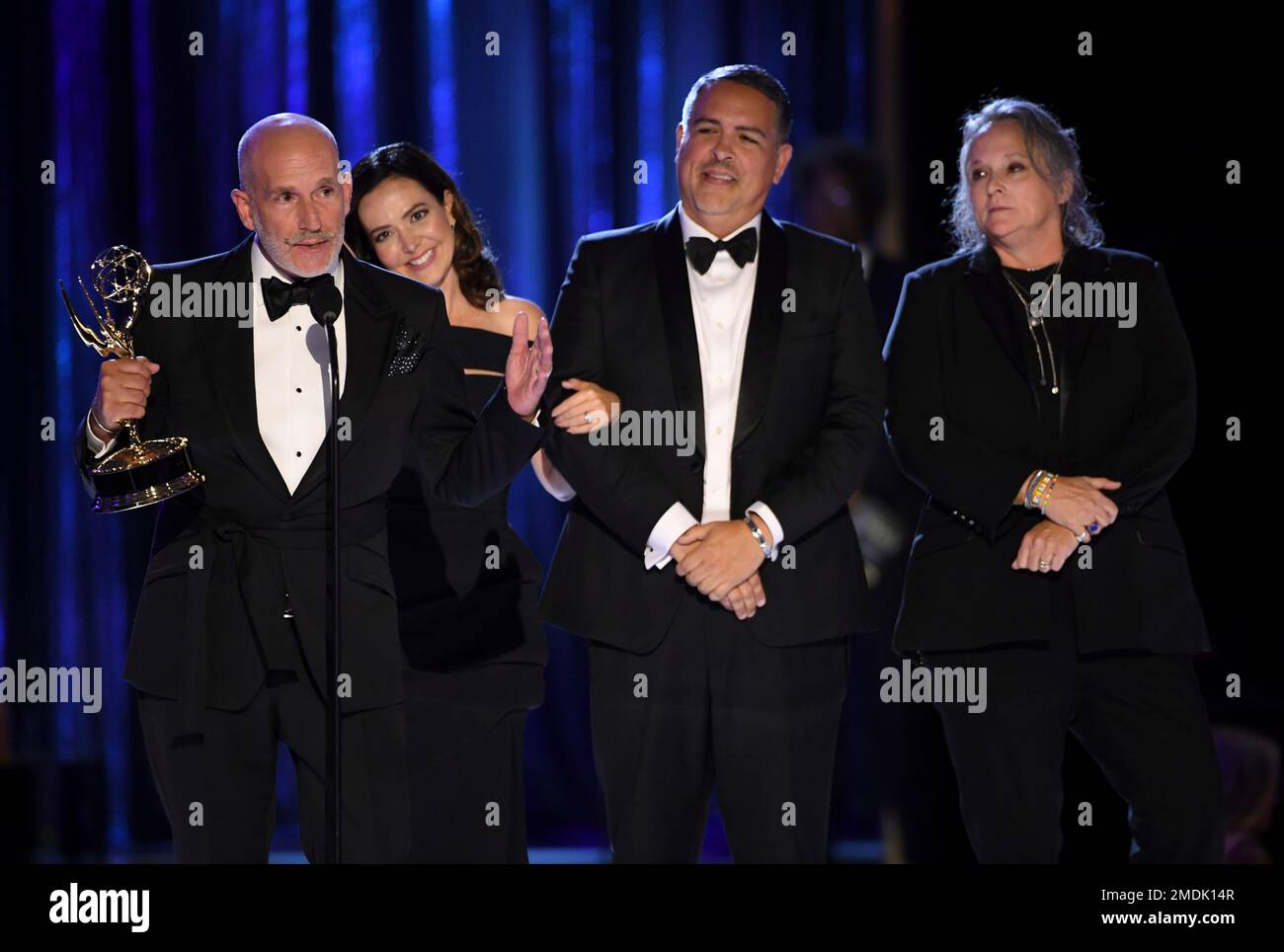 Rob Eric, from left, Jordana Hochman, Mark Bracero and Jennifer Lane accept the Emmy for ...
