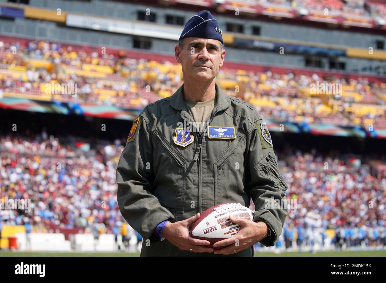 Lt. Gen. Marc H. Sasseville stands on the field as he is acknowledge for his role in defending ...