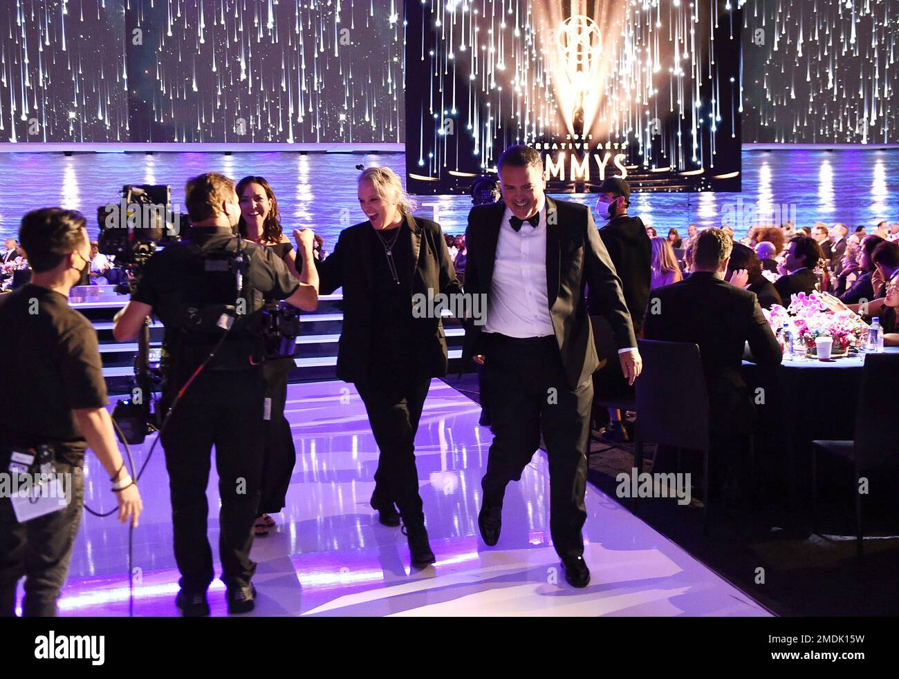 Mark Bracero, from right, Jordana Hochman and Jennifer Lane accept the Emmy for outstanding ...