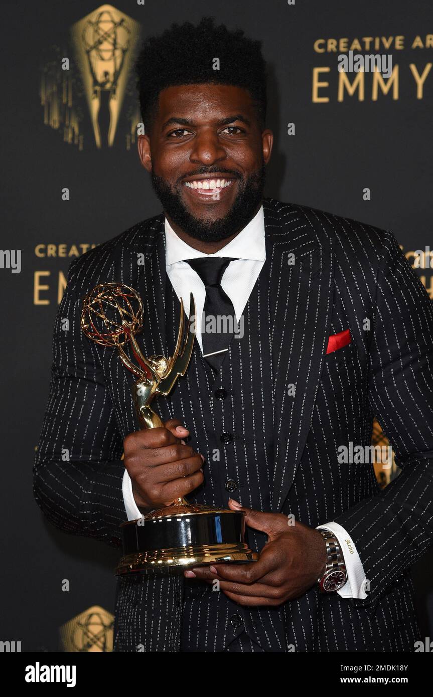 Emmanuel Acho poses with the award for short form nonfiction or reality ...