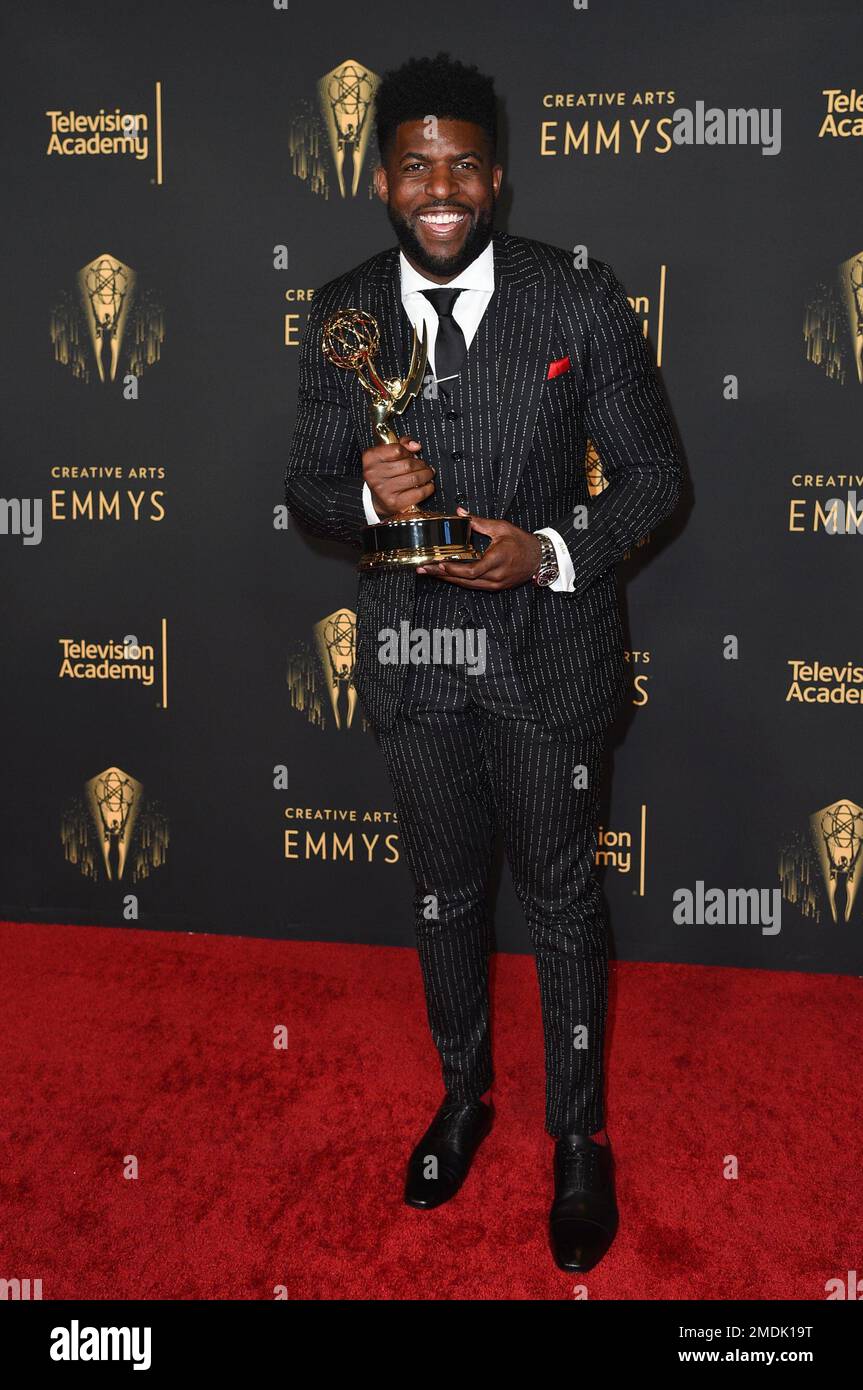 Emmanuel Acho poses with the award for short form nonfiction or reality ...