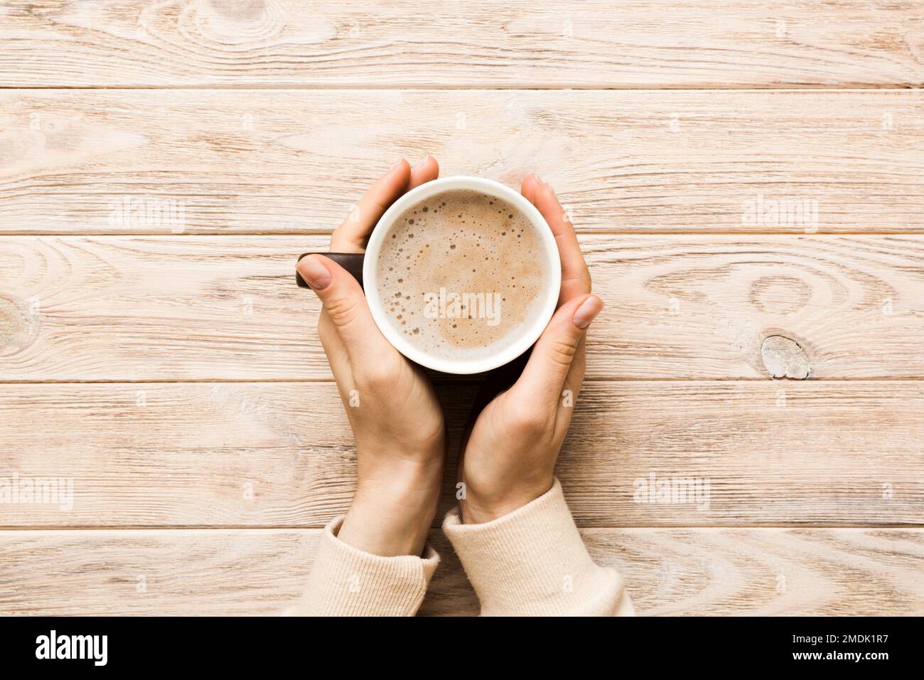 Minimalistic style woman hand holding a cup of coffee on Colored ...