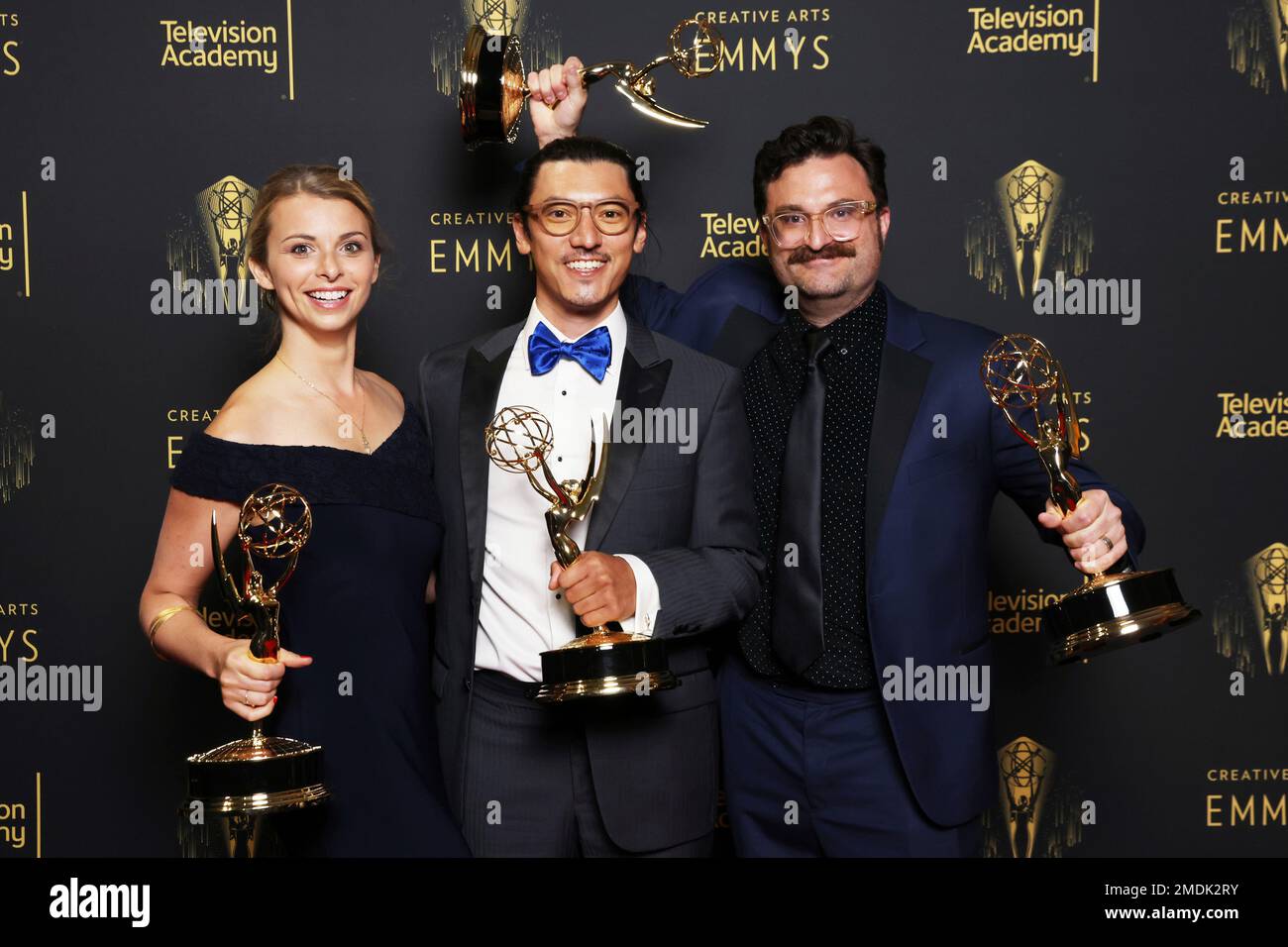 Vickie Curtis, from left, Jeff Orlowski and Davis Coombe, accept the ...