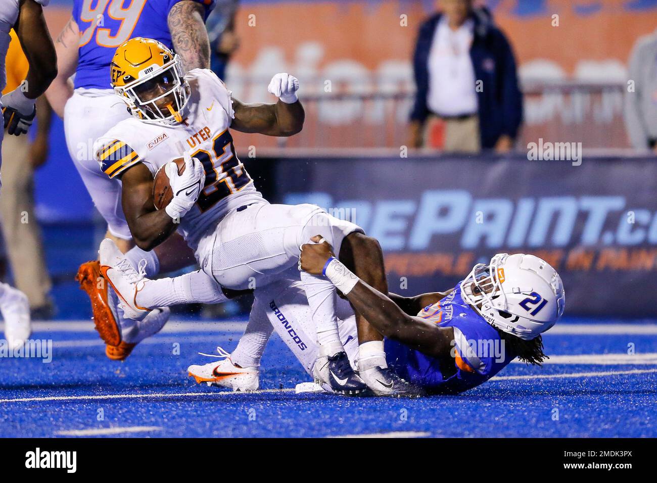 UTEP running back Ronald Awatt (22) is pulled down for a loss of 2 ...