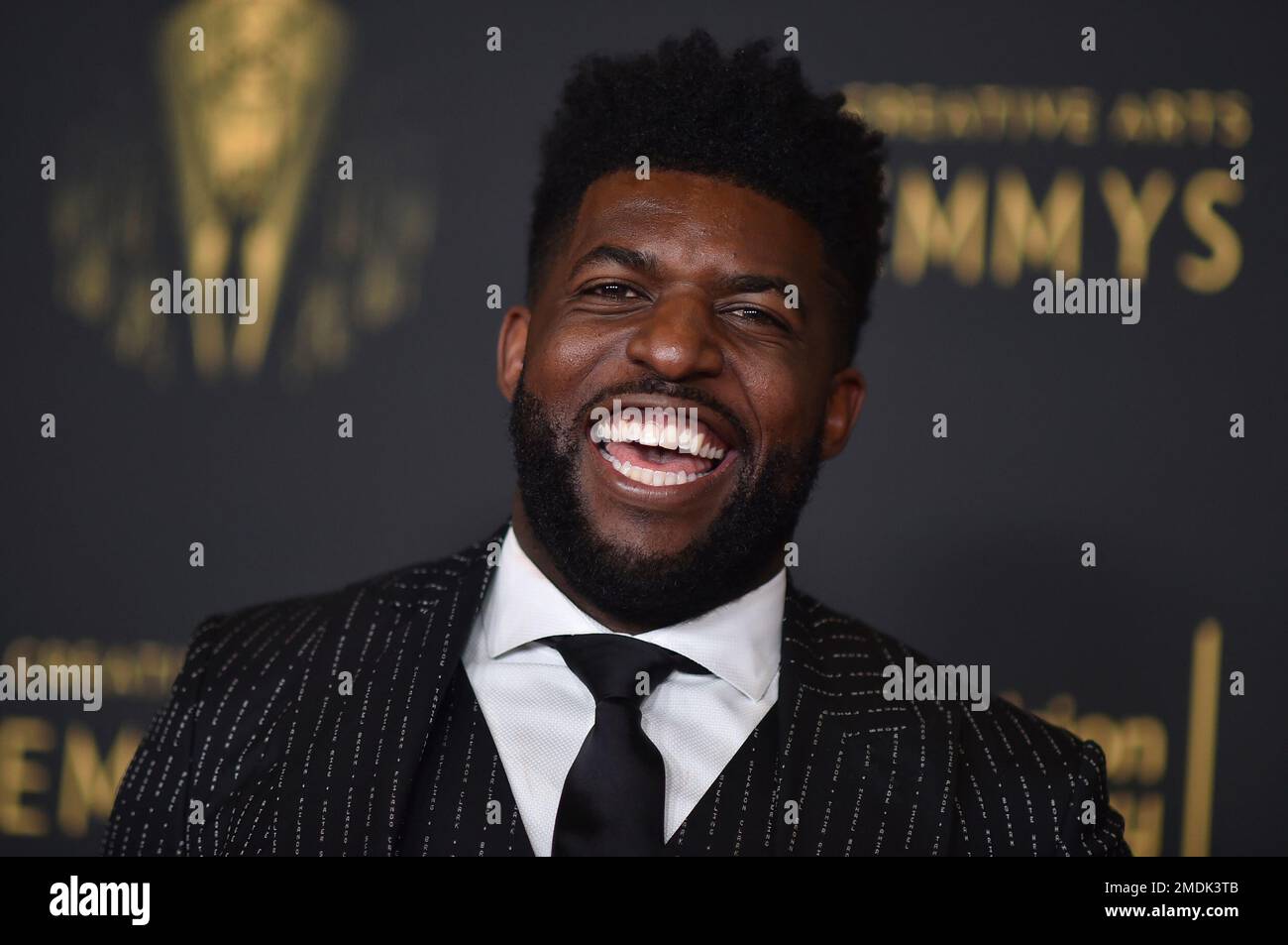 Emmanuel Acho poses with the award for short form nonfiction or reality ...