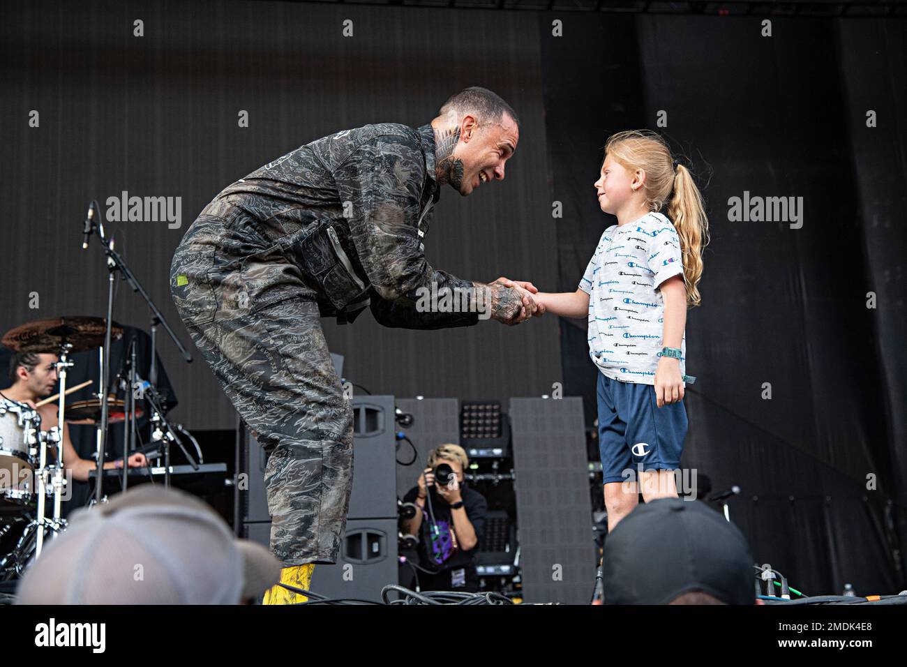 Jason Aalon Butler of Fever 333 performs on stage with fan Jaylyn ...