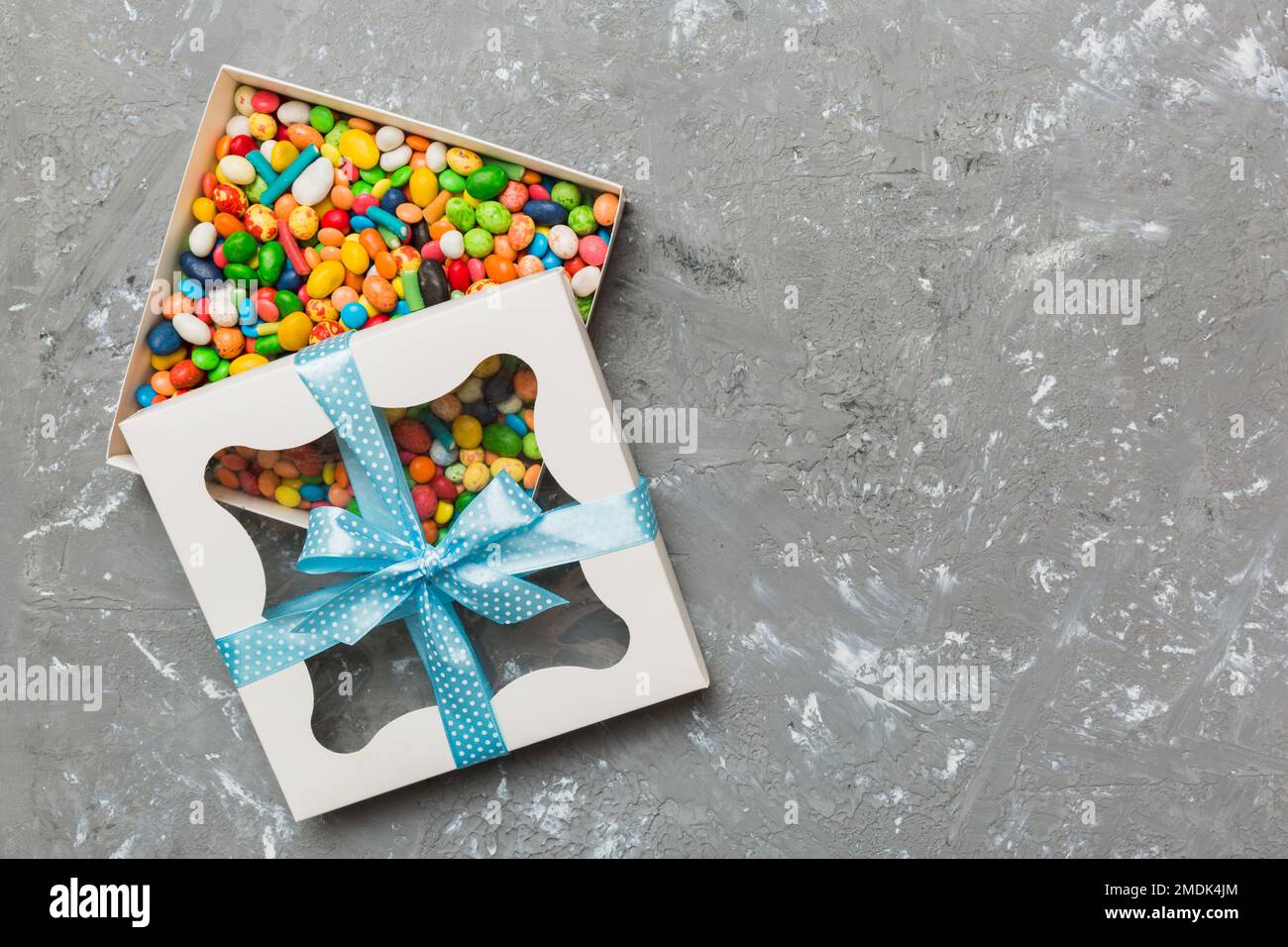 Box with sweet chocolate candies on color background, Various candy ...