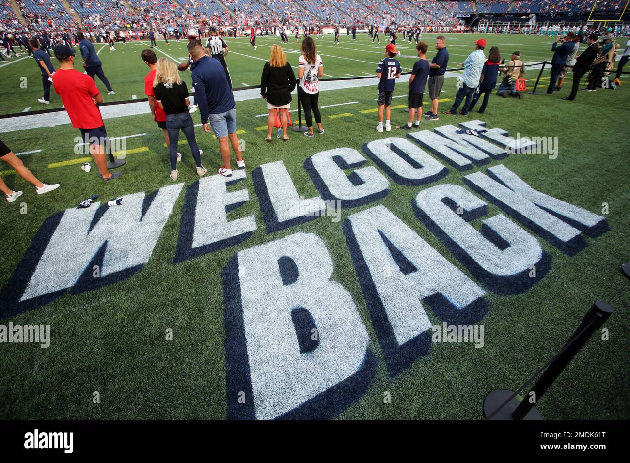 A Welcome Back is painted on the sidelines as fans watch the New ...