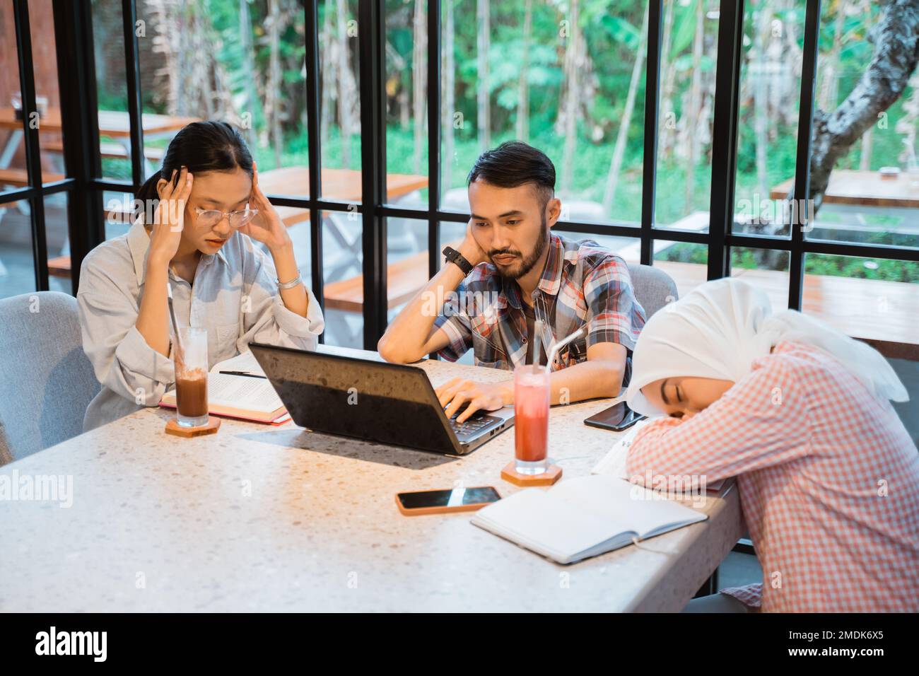 group of sad college students facing difficulties while working ...