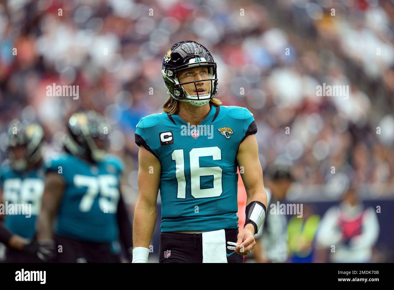 Jacksonville Jaguars quarterback Trevor Lawrence looks up toward the ...