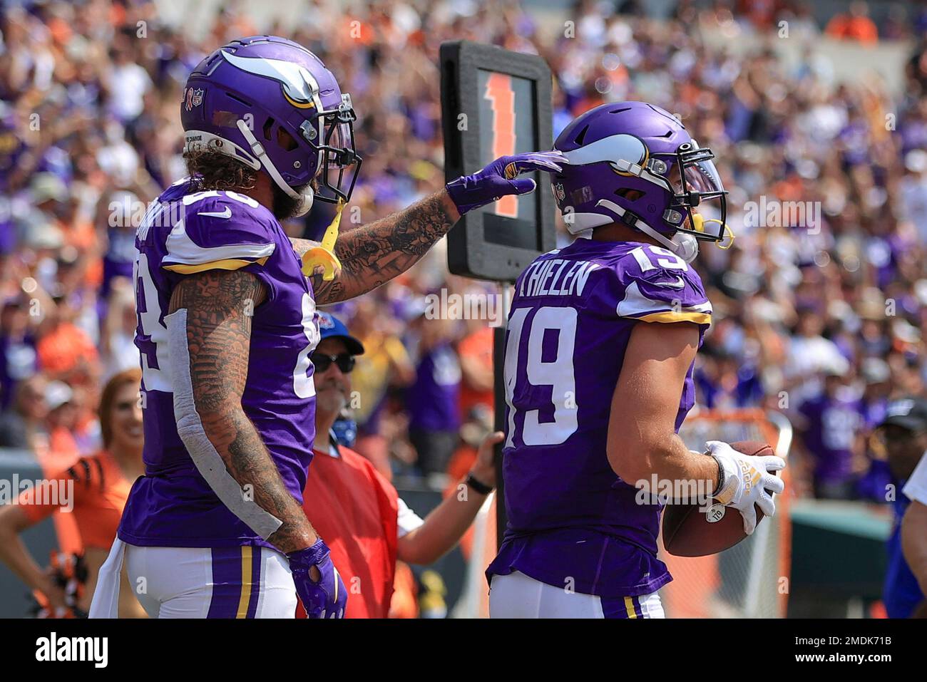 Minnesota Vikings wide receiver Adam Thielen (19) is greeted by tight ...