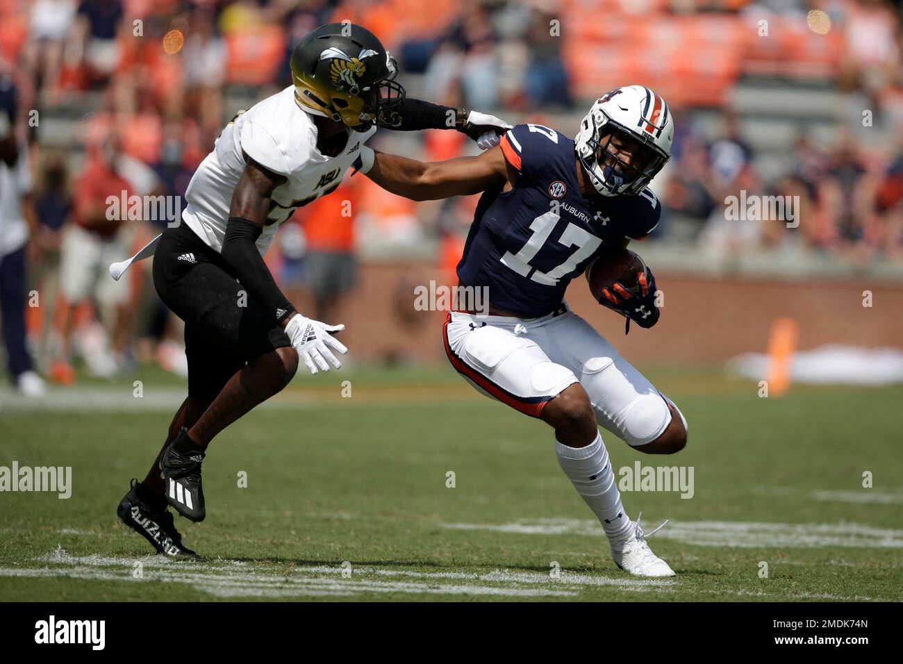 Auburn wide receiver Elijah Canion (17) tries to break free from ...