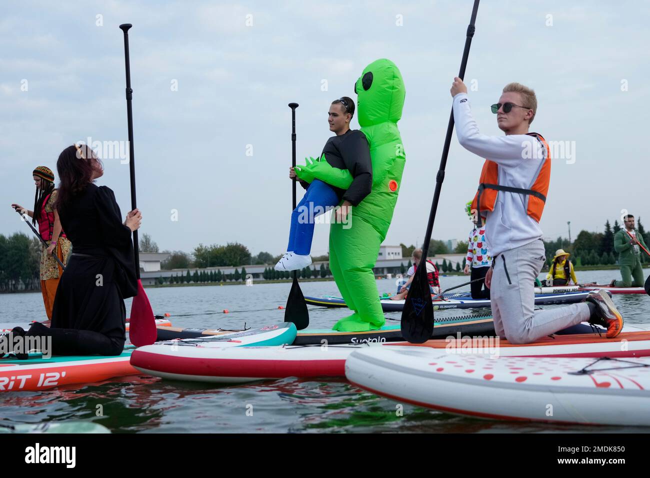 People steer their SUP boards during a SUP (Stand Up Paddle)-Surfing ...